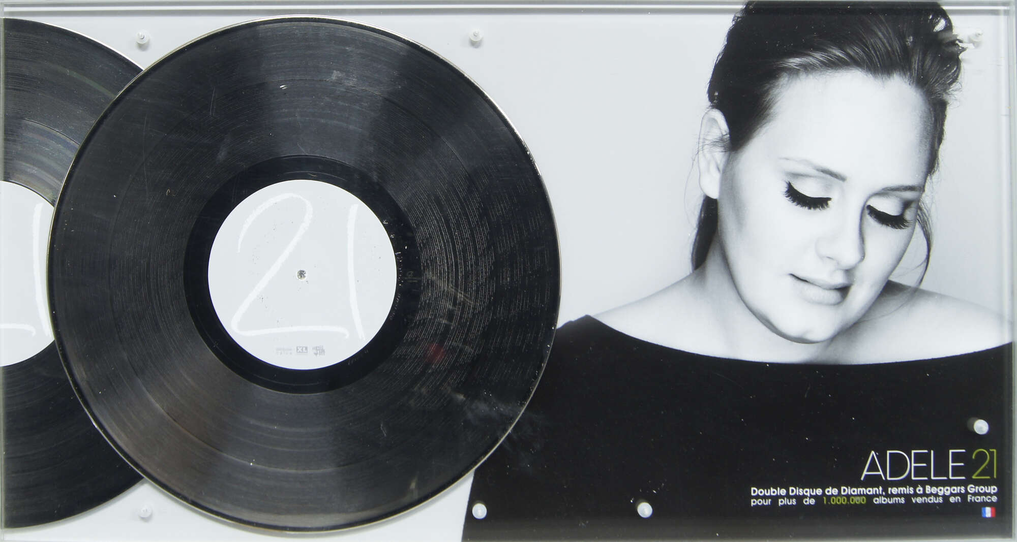 Roseberys London | A presentation silver disc awarded to Adele for the