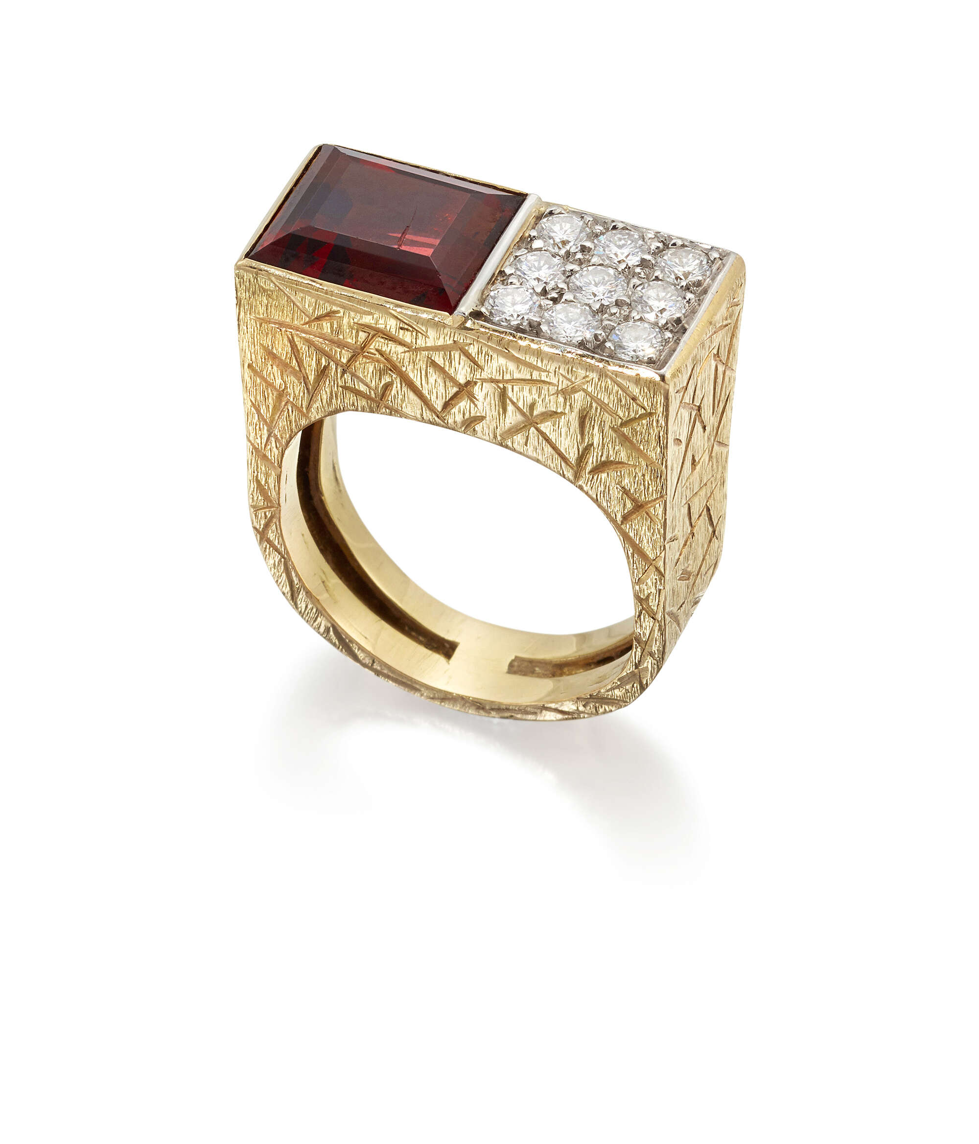 Roseberys London | An 18ct gold, garnet and diamond ring by Andrew Grima,