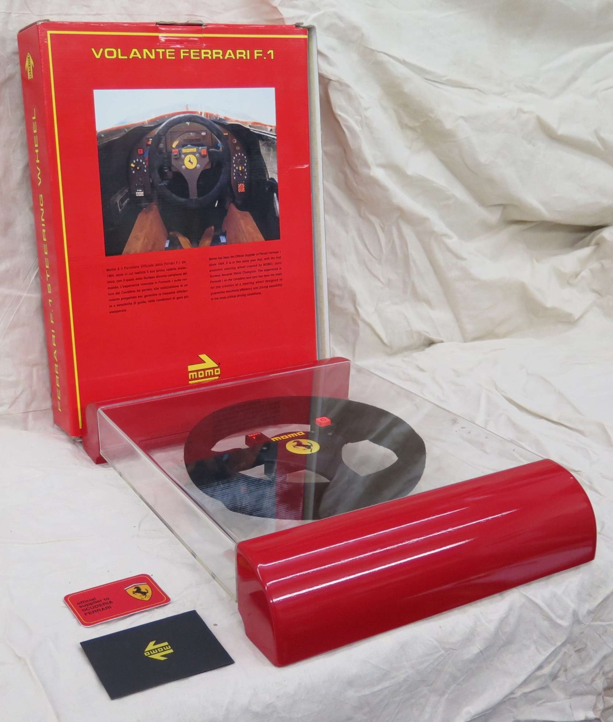 Iconic Auctioneers | A 'Volante Ferrari F1' boxed Momo steering wheel ...